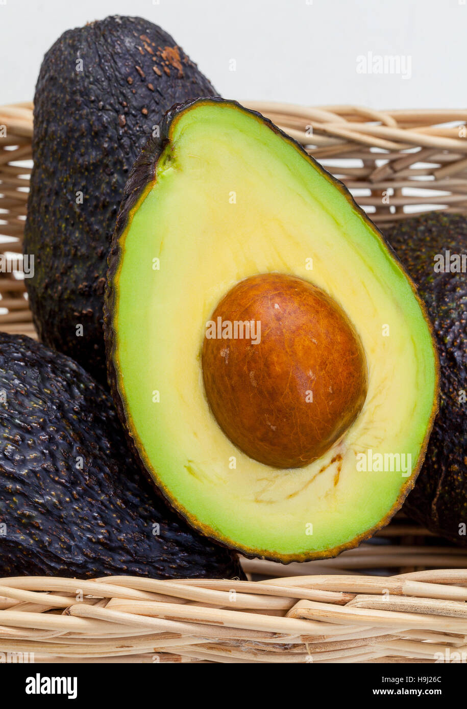 Halved avocado with core - in macro shot Stock Photo - Alamy