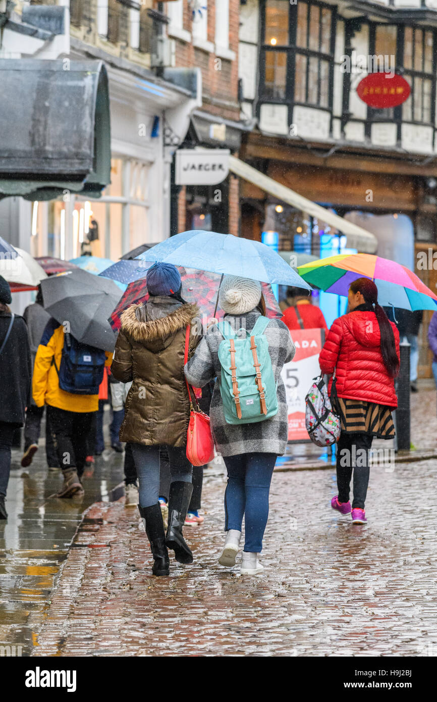 Tourists with umbrellas during a wet day on St John's street in ...