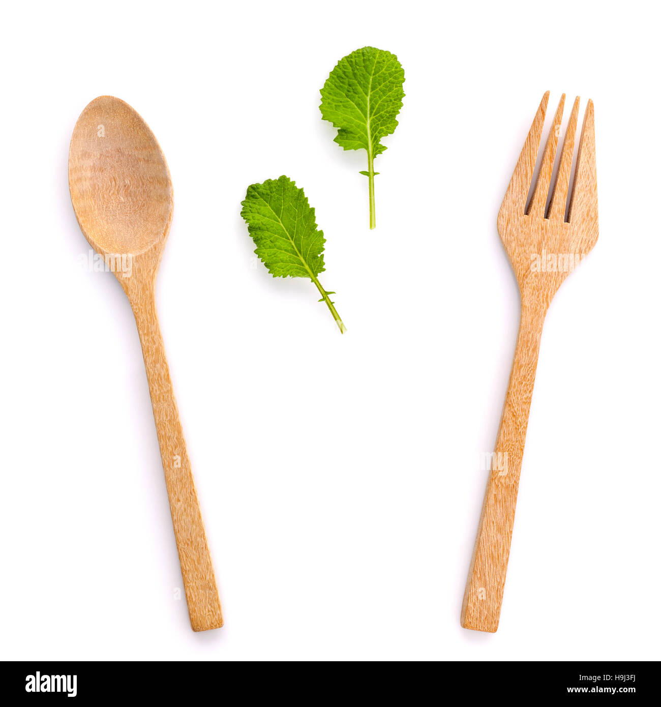 Healthy food concept fresh organic green leaves with wooden fork Stock ...