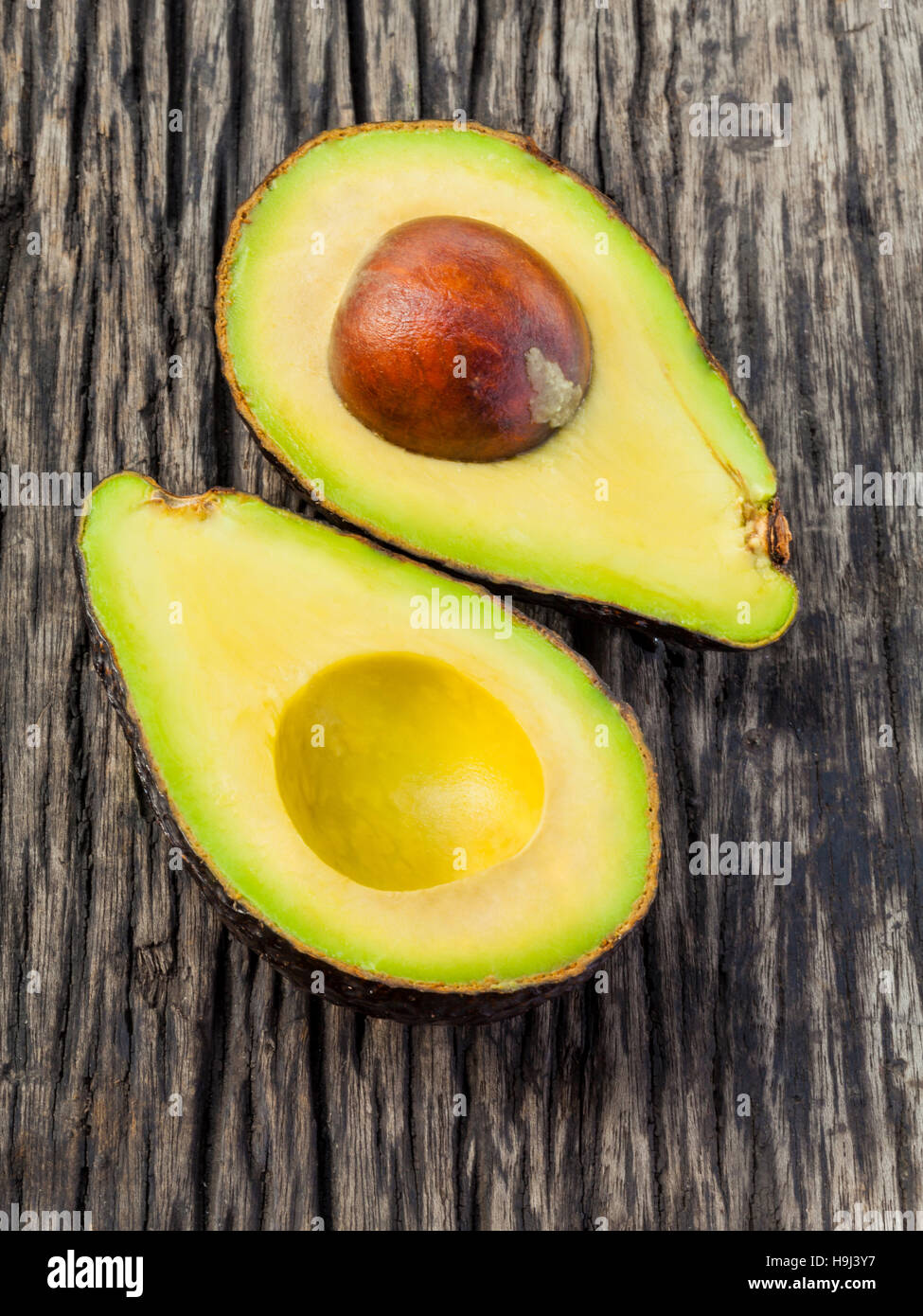 Halved avocado with core isolated on white - in macro shot Stock Photo ...