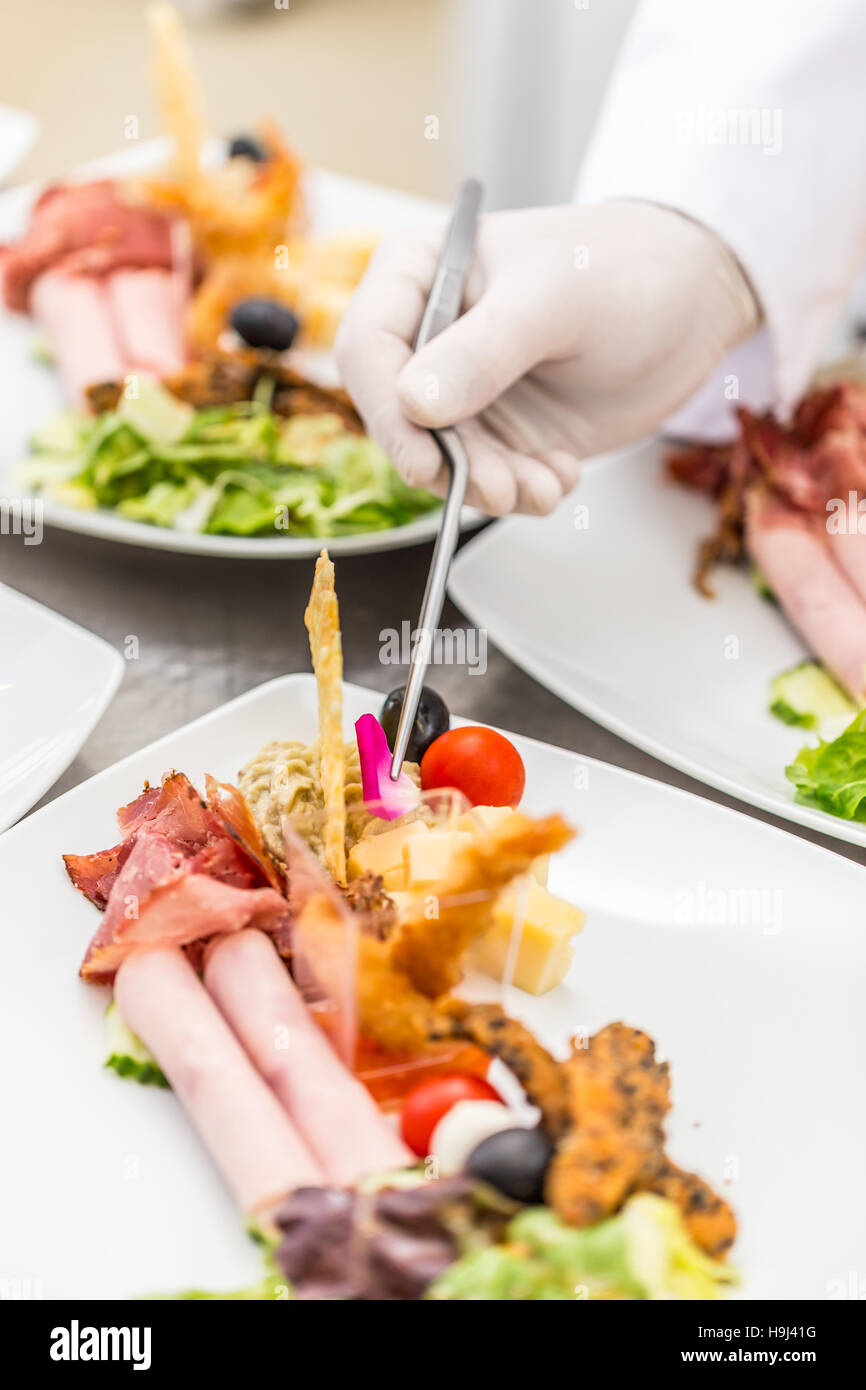 Chef garnishing delicious dish Stock Photo - Alamy