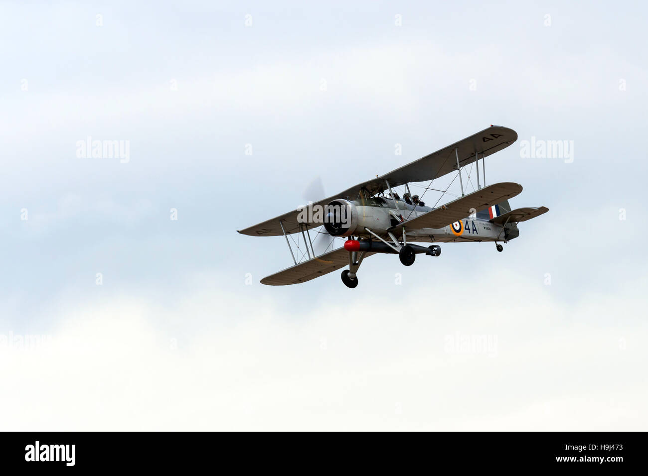Royal Navy Fairey Swordfish biplane with air crew waving on flypast at ...