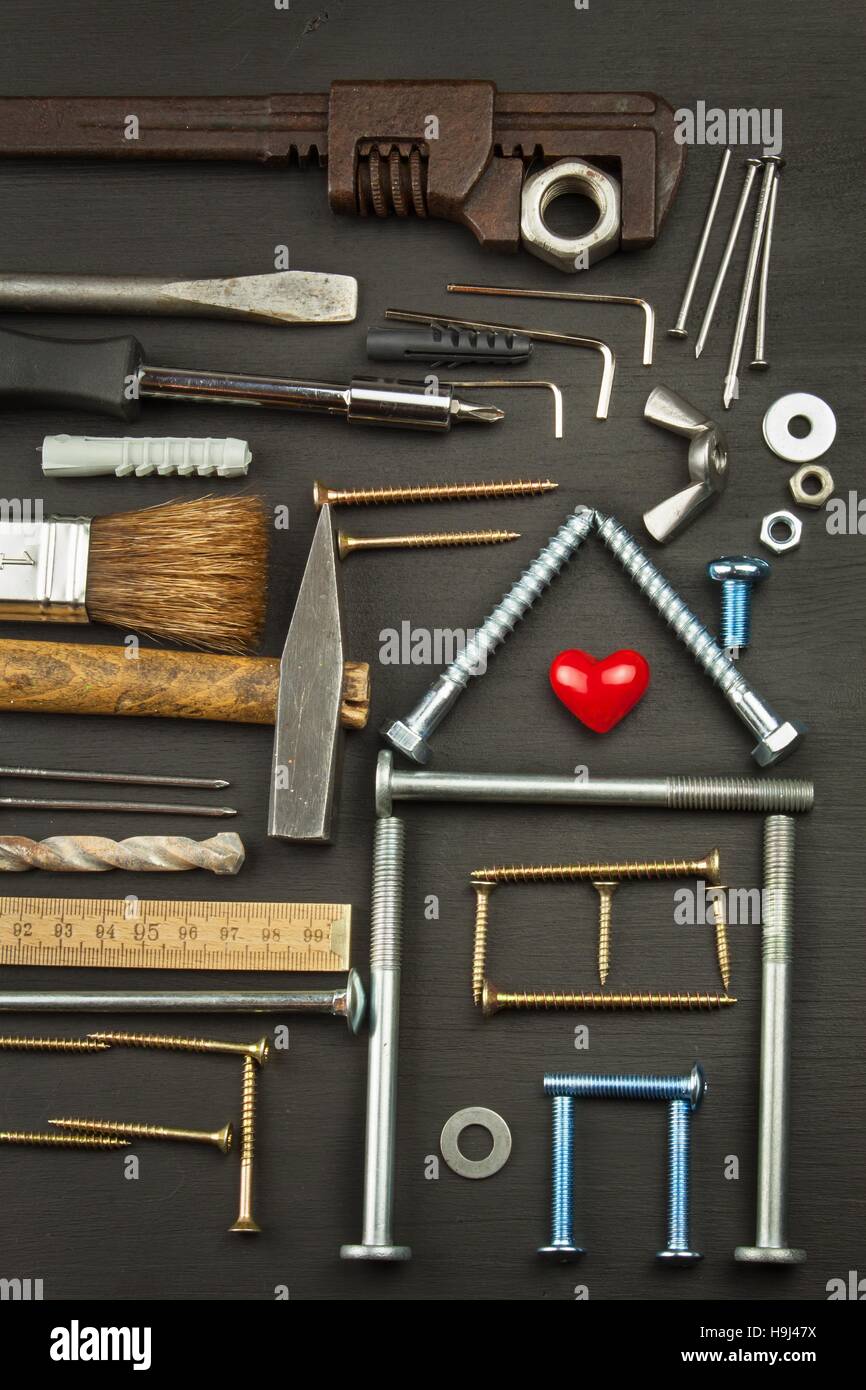 Plans to build a house. Rustic wooden background. Tools for builders ...