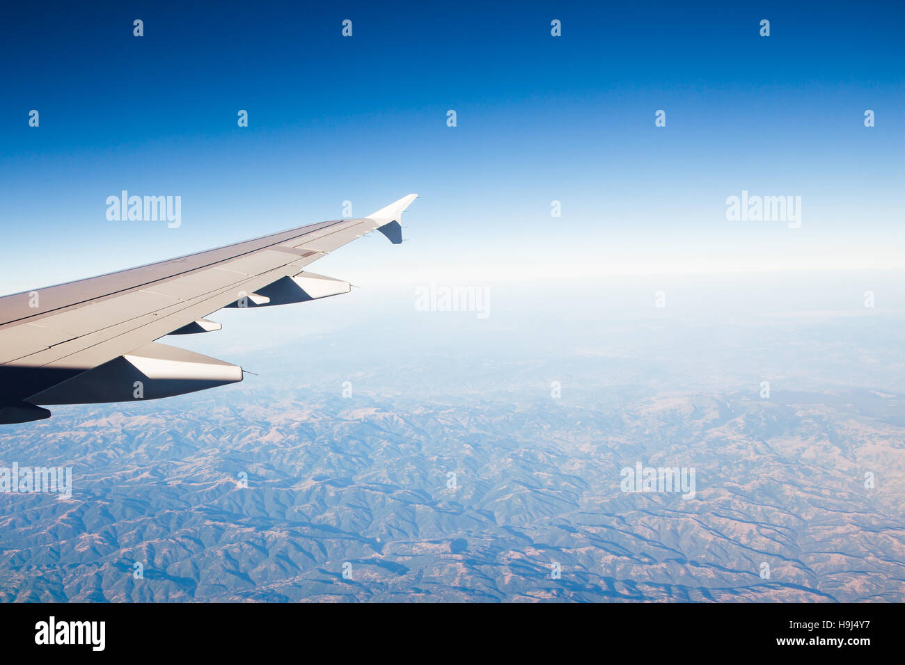 mountains landscape from airplane aircraft window Stock Photo - Alamy