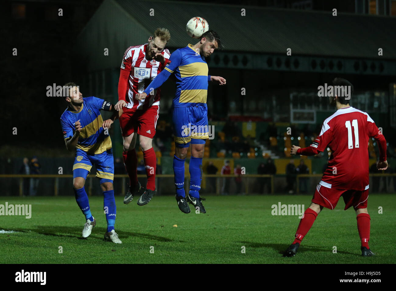 Chris Taylor of Romford rises with Callum Leahy of Bowers during ...