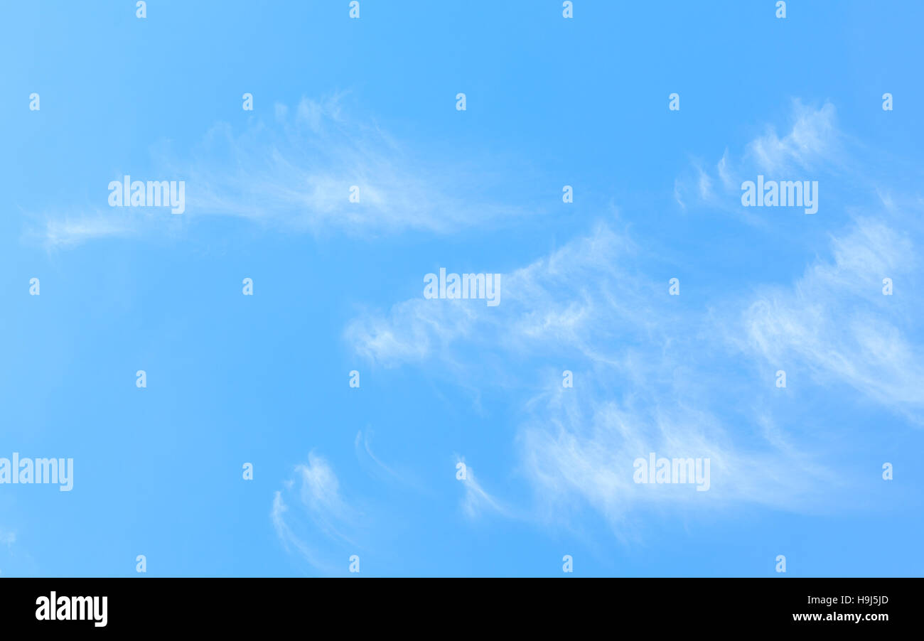 Mostly clear sky with small nice white cloud Stock Photo - Alamy