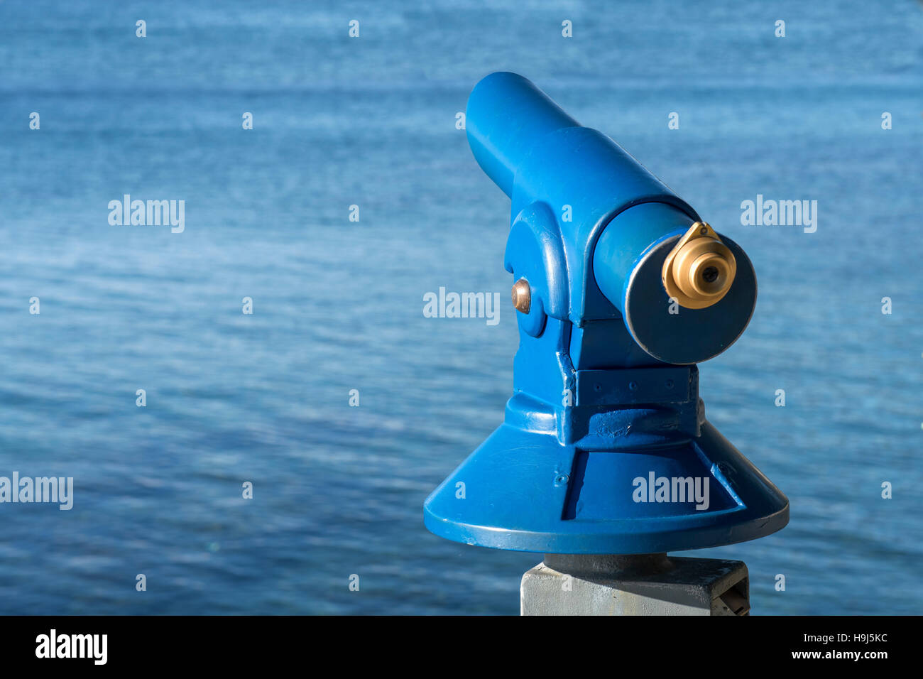 Blue public coin operated tourist telescope - monocular Stock Photo - Alamy