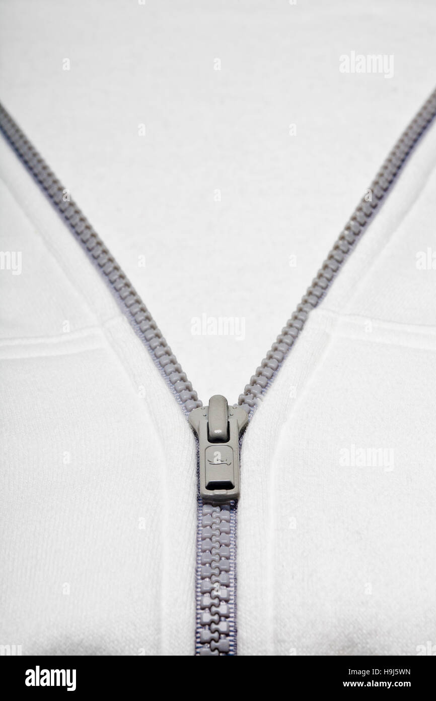 high-key photo of partially unzipped zipper in white sweatshirt Stock ...