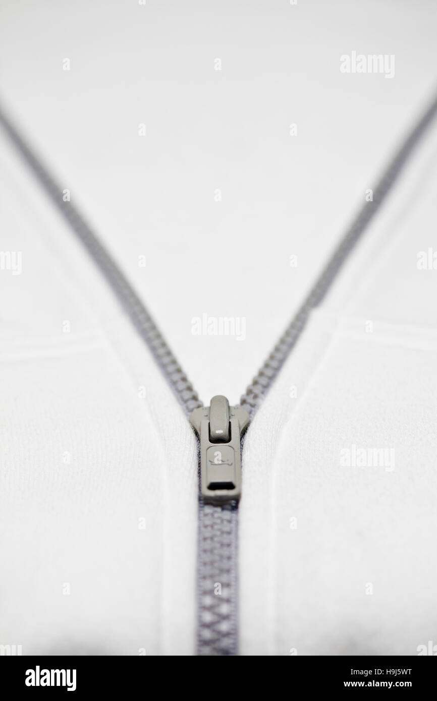 high-key photo of partially unzipped zipper in white sweatshirt Stock ...