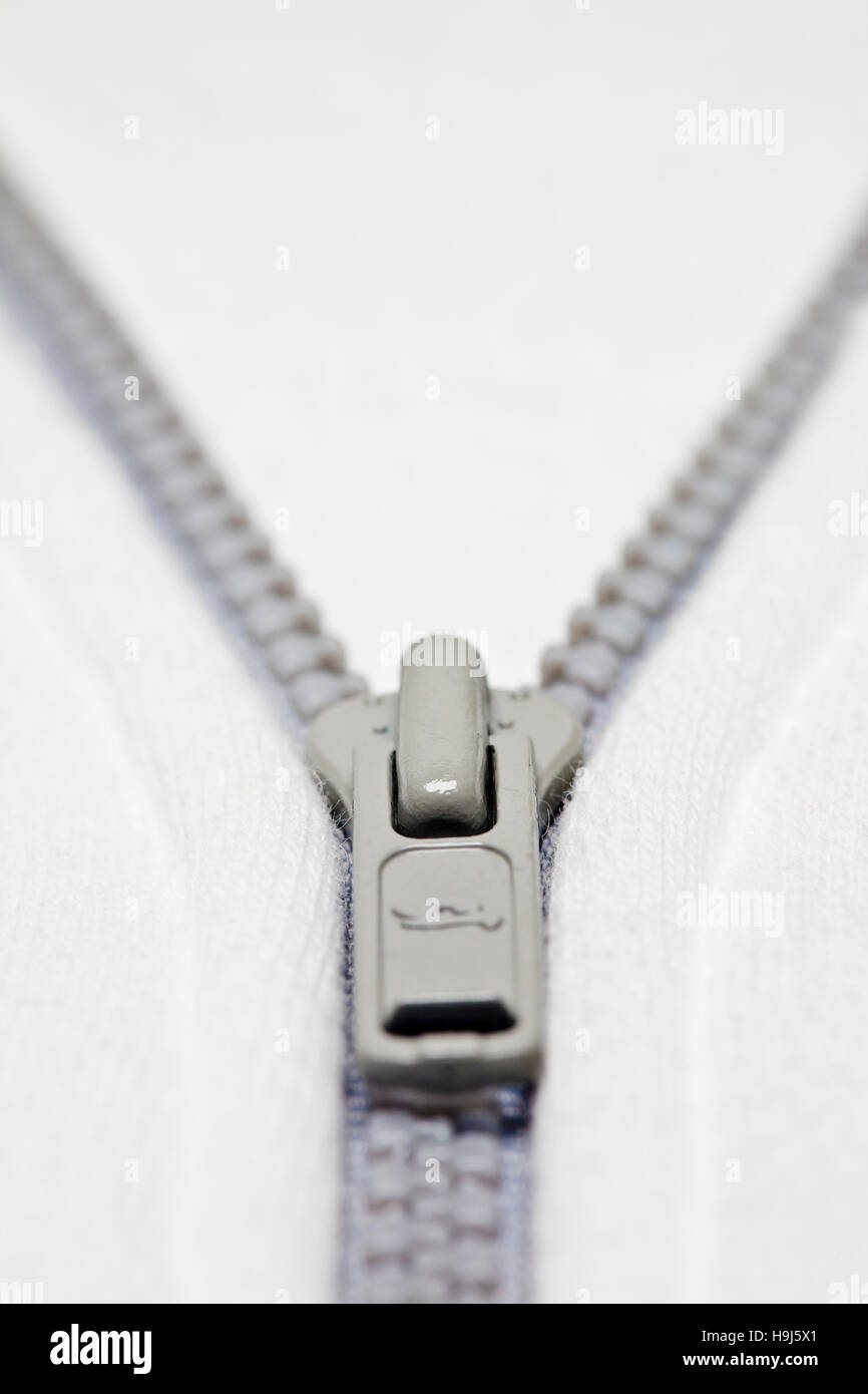high-key photo of partially unzipped zipper in white sweatshirt Stock ...