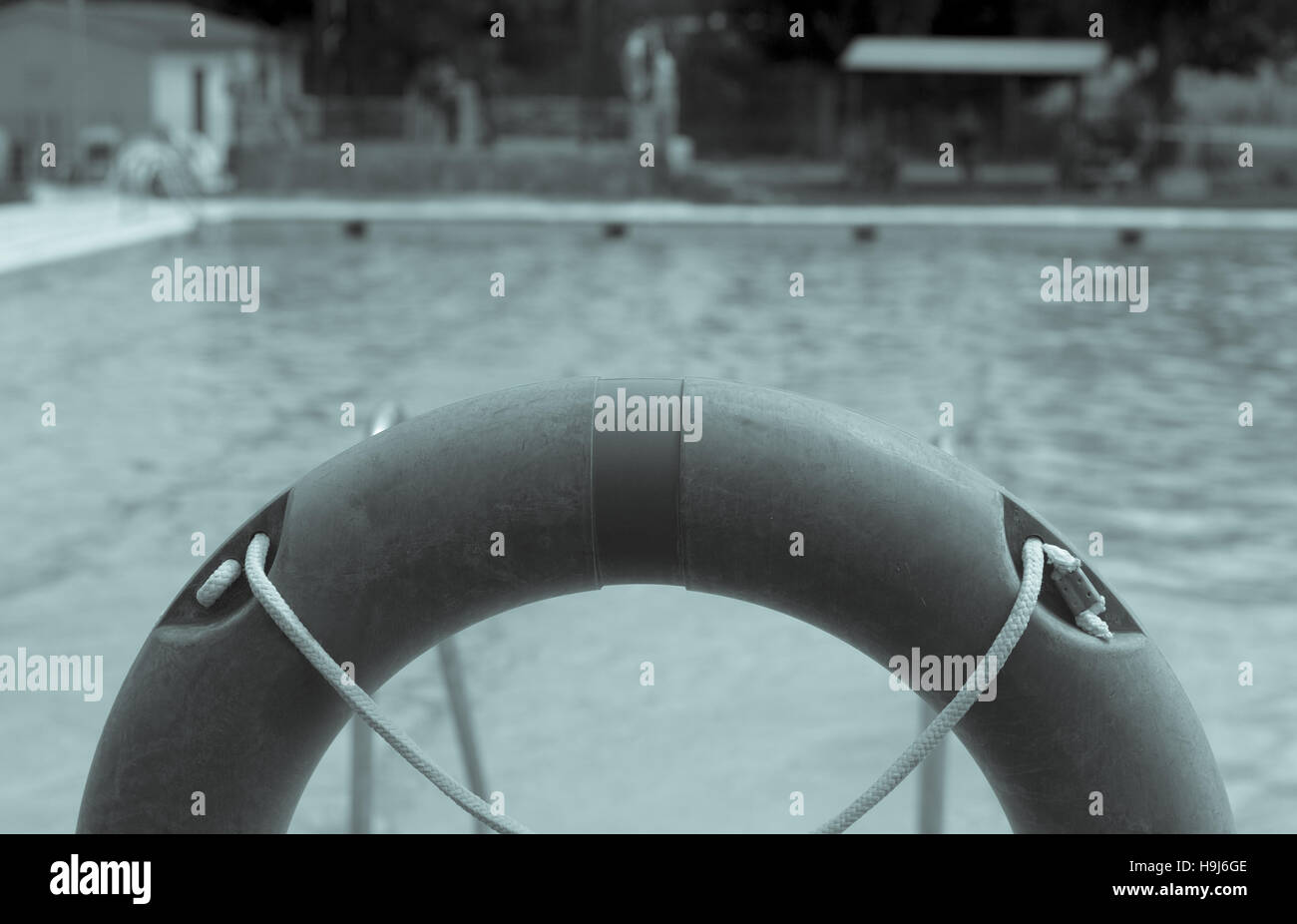 Orange life float. View of pool in the background unfocused Stock Photo ...
