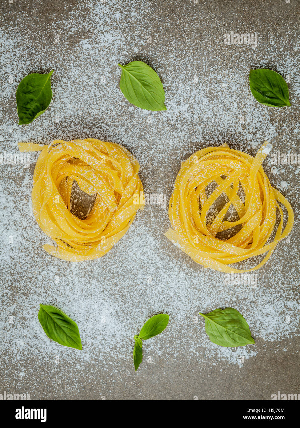 Italian food concept pasta with sweet basil with flour setup on Stock ...