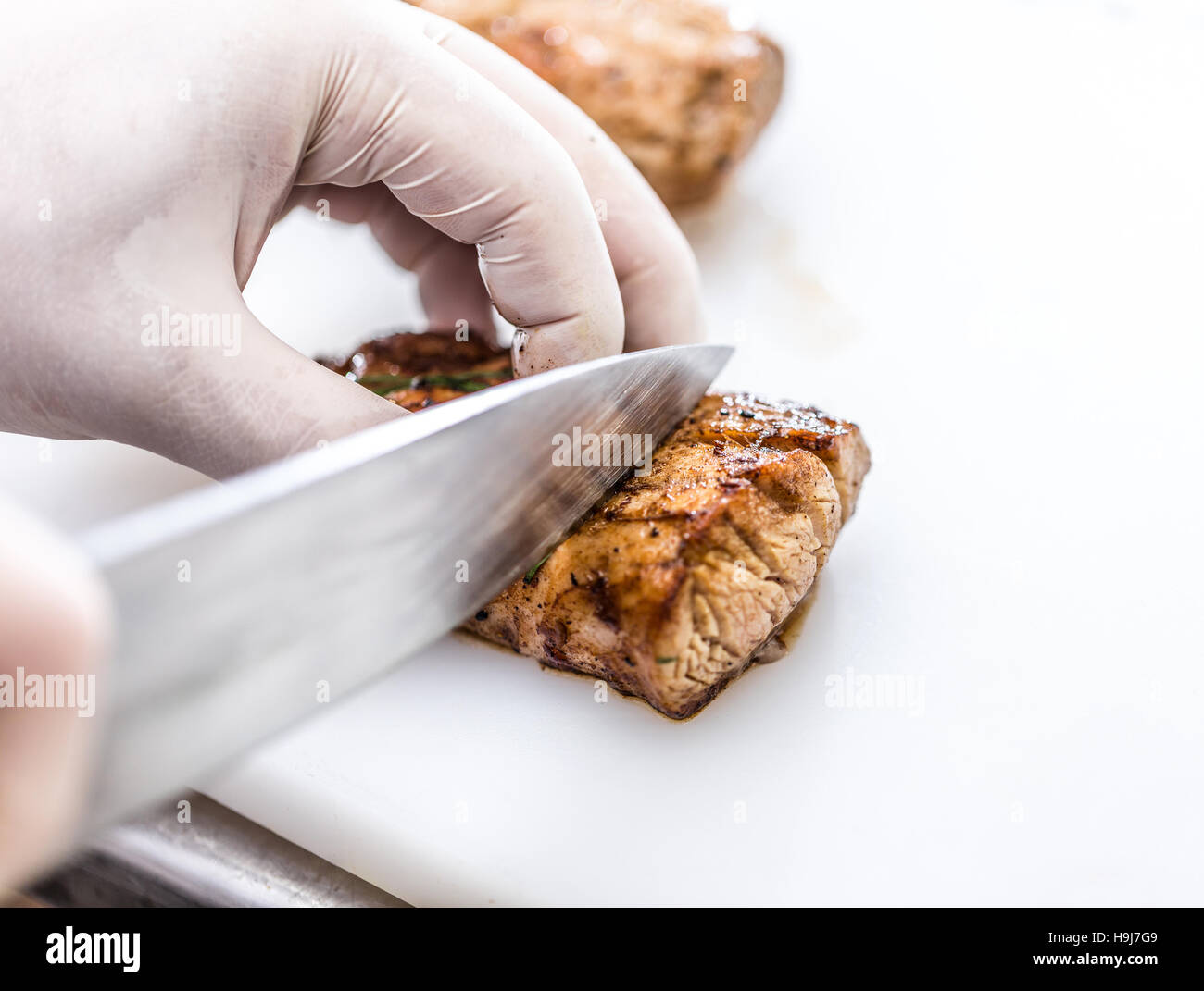 Chef cutting meat Stock Photo - Alamy