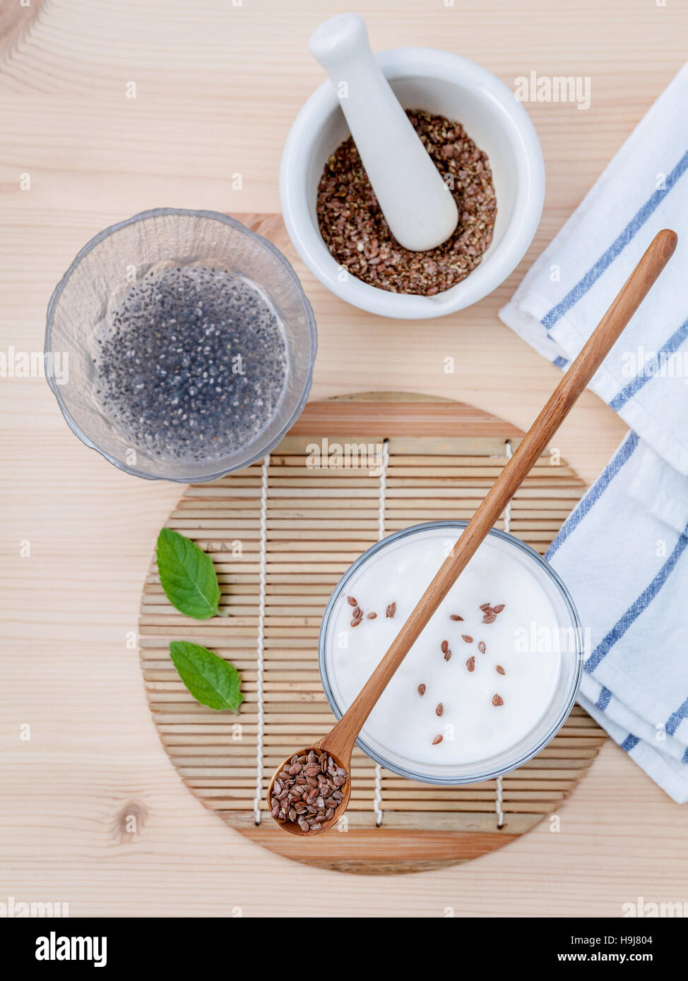 Nutritious flax seeds with glass of greek yogurt and wooden spoo Stock ...