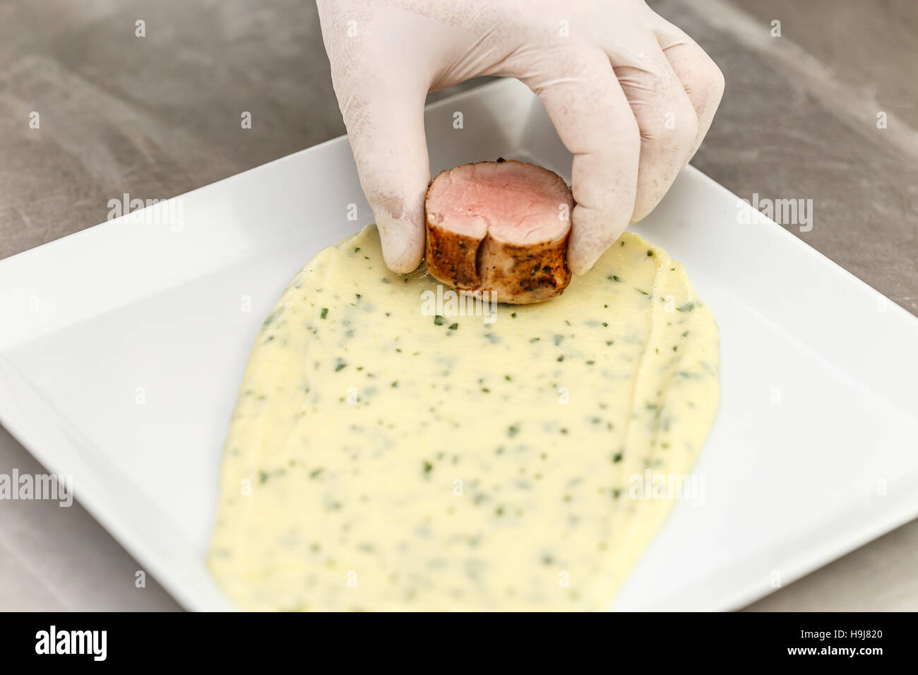 Chef making meat dish Stock Photo - Alamy