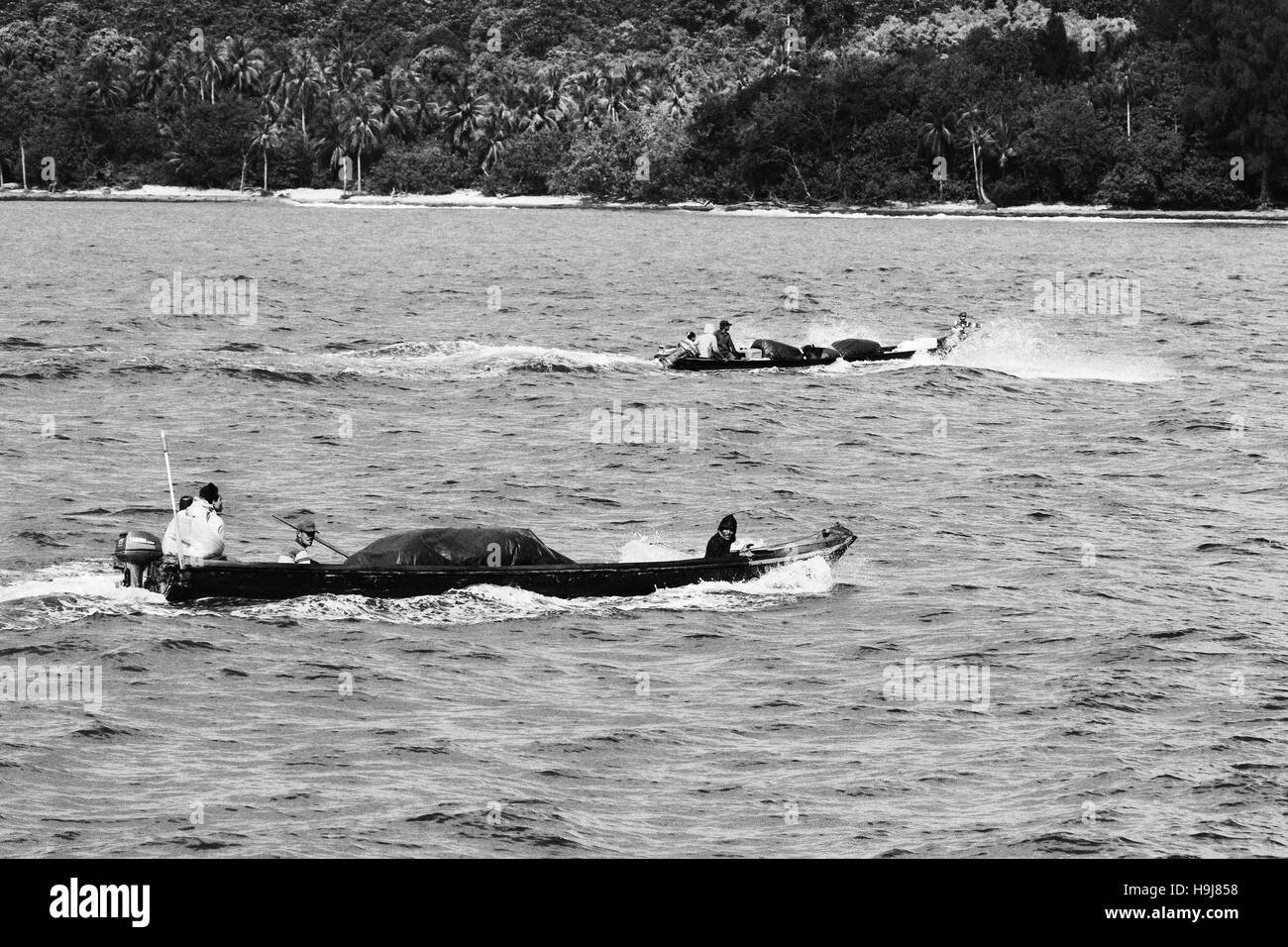 Fast fishing canoes Stock Photo - Alamy