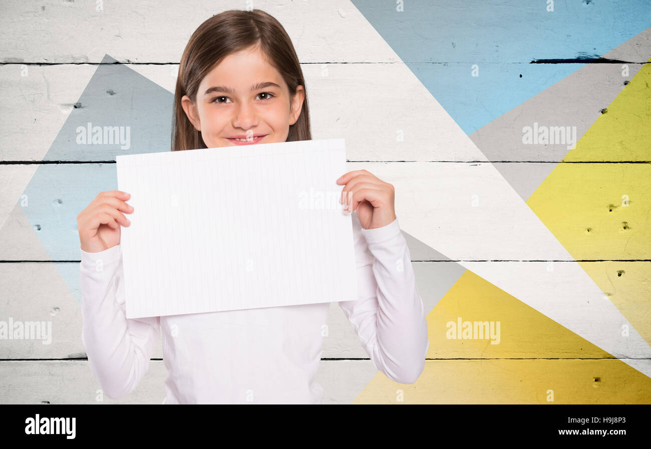 Composite image of cute little girl showing card Stock Photo - Alamy
