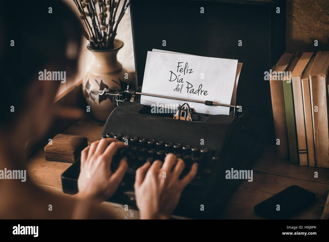 Woman typing on typewriter Stock Photo - Alamy