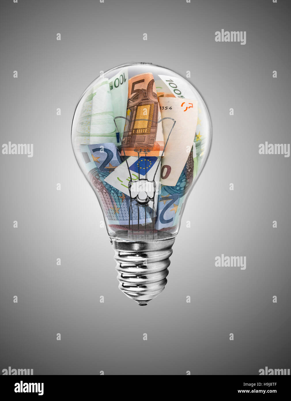 Light bulb with euro bills inside Stock Photo - Alamy
