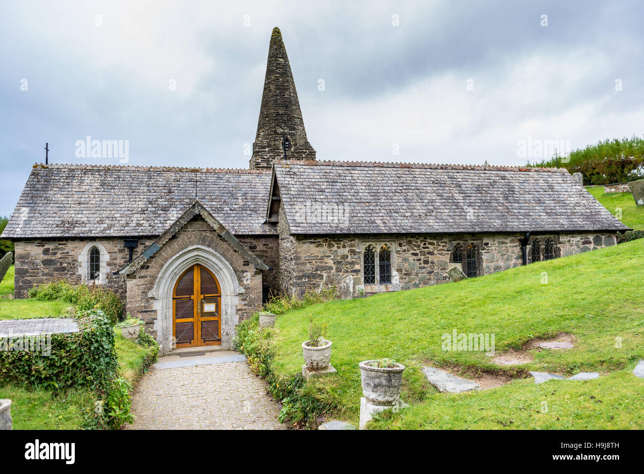 The church at St Enodoc is partially submerged in the sand dunes on the ...
