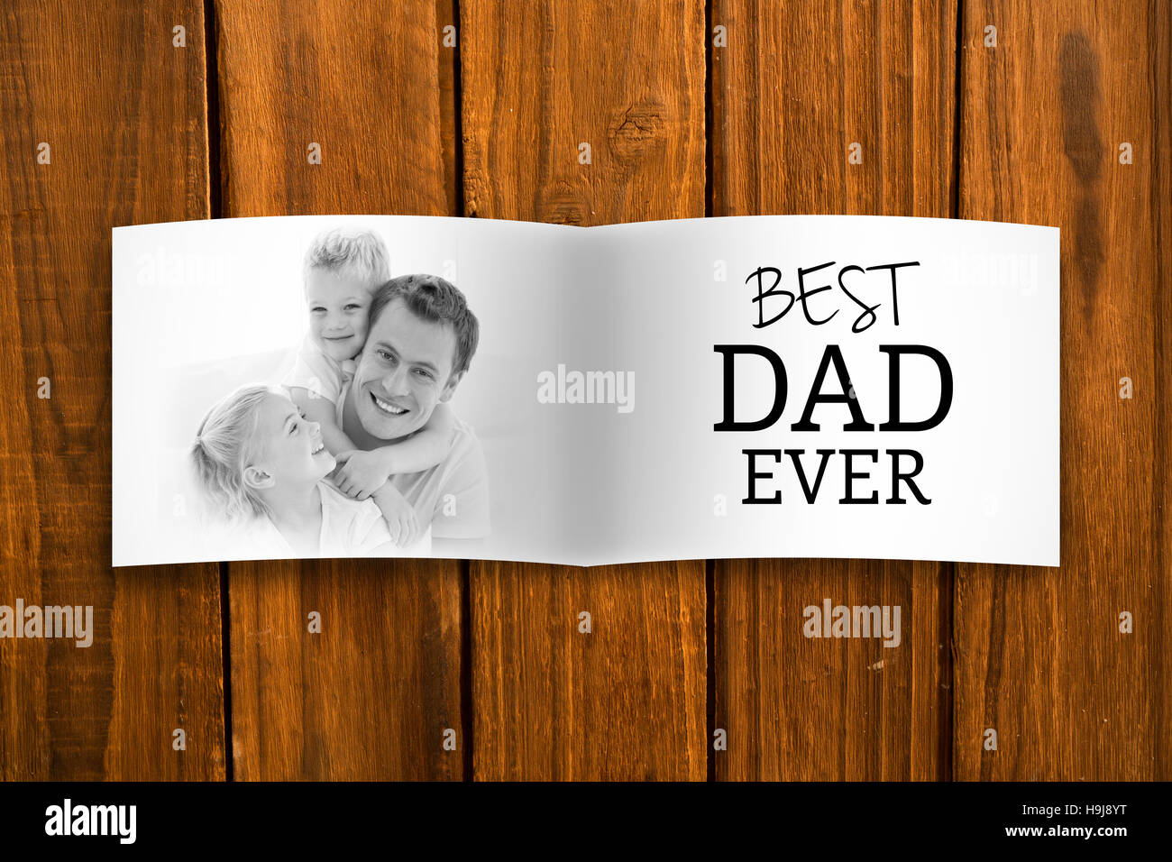 Composite image of fathers day gift and family picture Stock Photo - Alamy