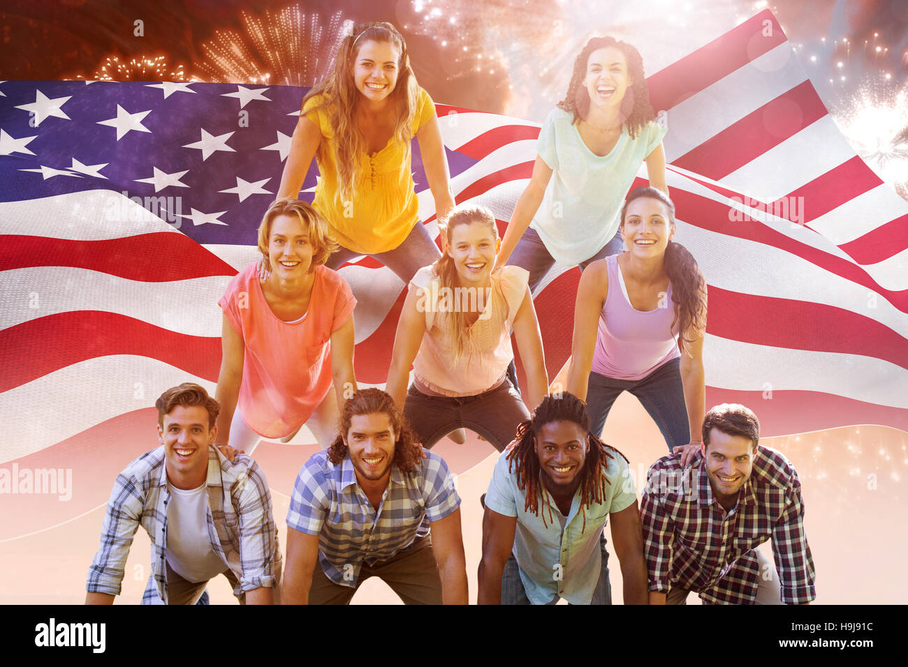 Composite image of happy friends making human pyramid Stock Photo - Alamy