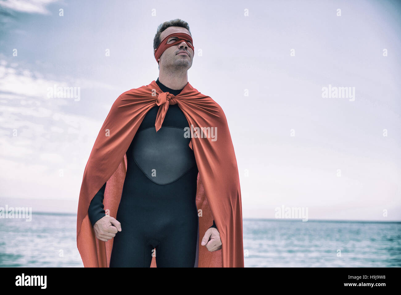 Man wearing red cape hi-res stock photography and images - Alamy