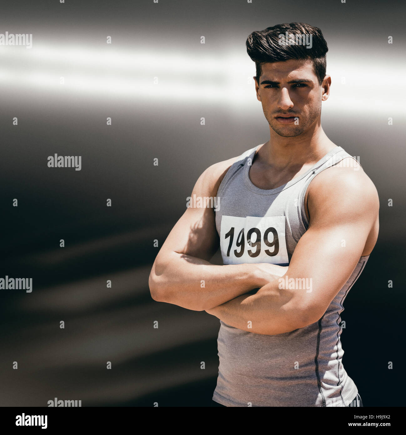 Composite image of portrait of handsome sportsman is posing with ...