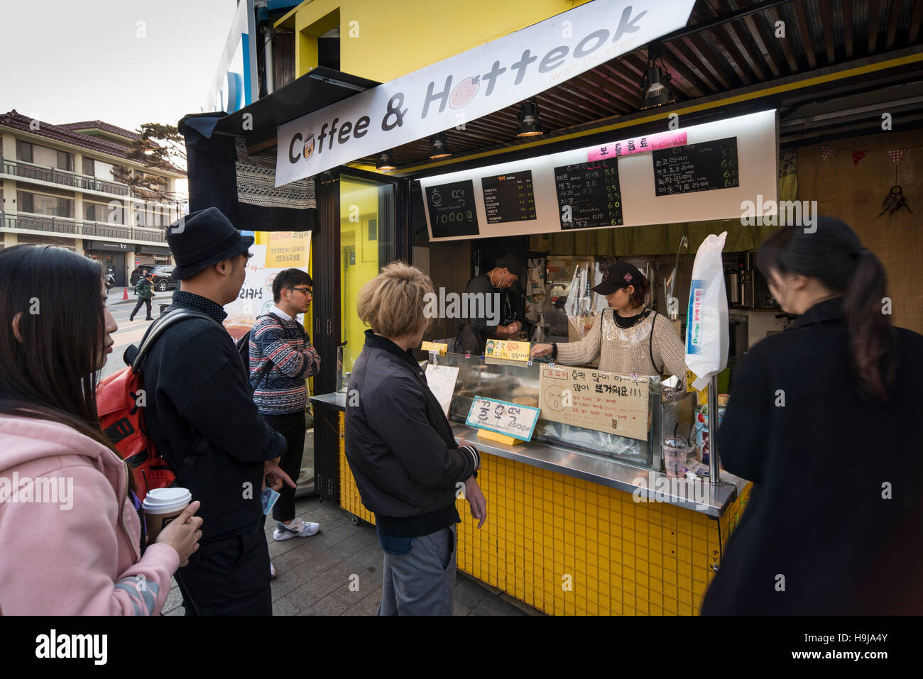 Street food stall selling coffee and Hotteok (Korean pancakes) in ...