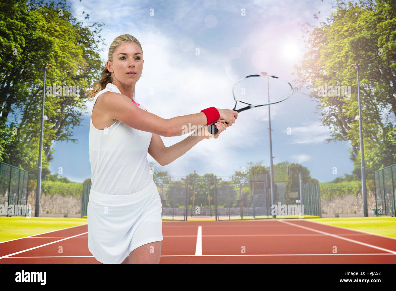 Composite image of athlete playing tennis with a racket Stock Photo - Alamy