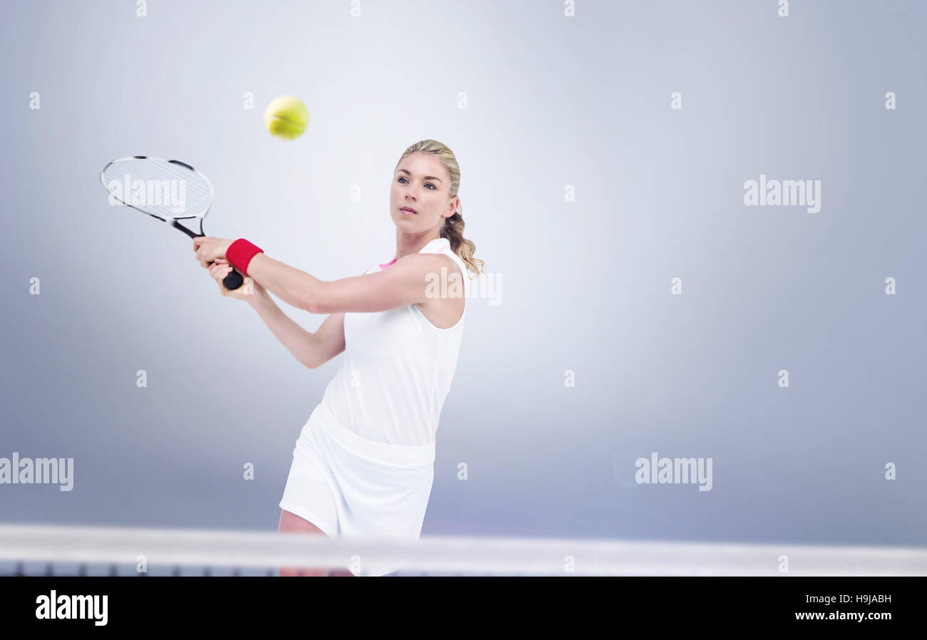 Composite image of athlete playing tennis with a racket Stock Photo - Alamy
