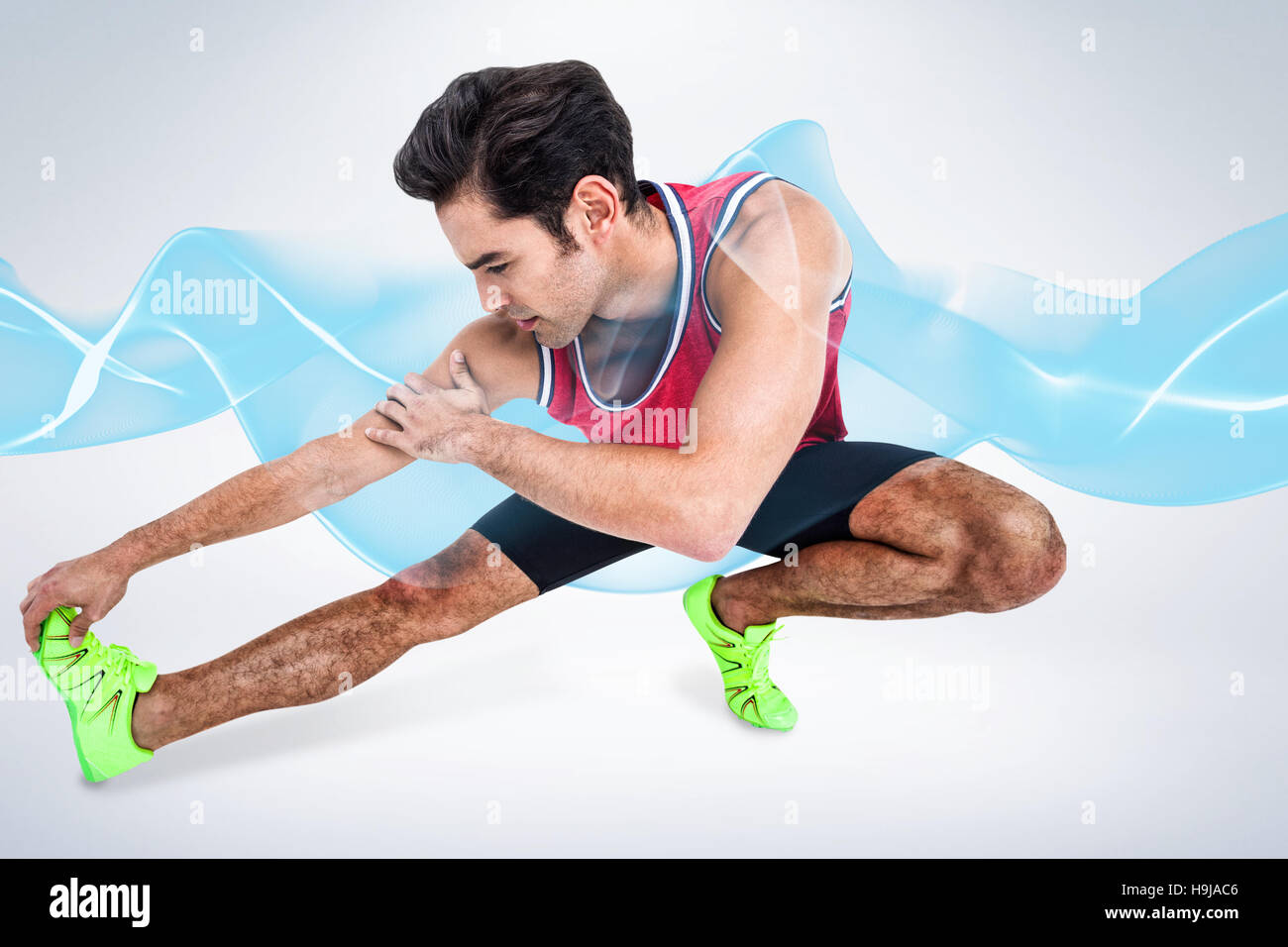 Composite image of male athlete stretching his hamstring Stock Photo ...