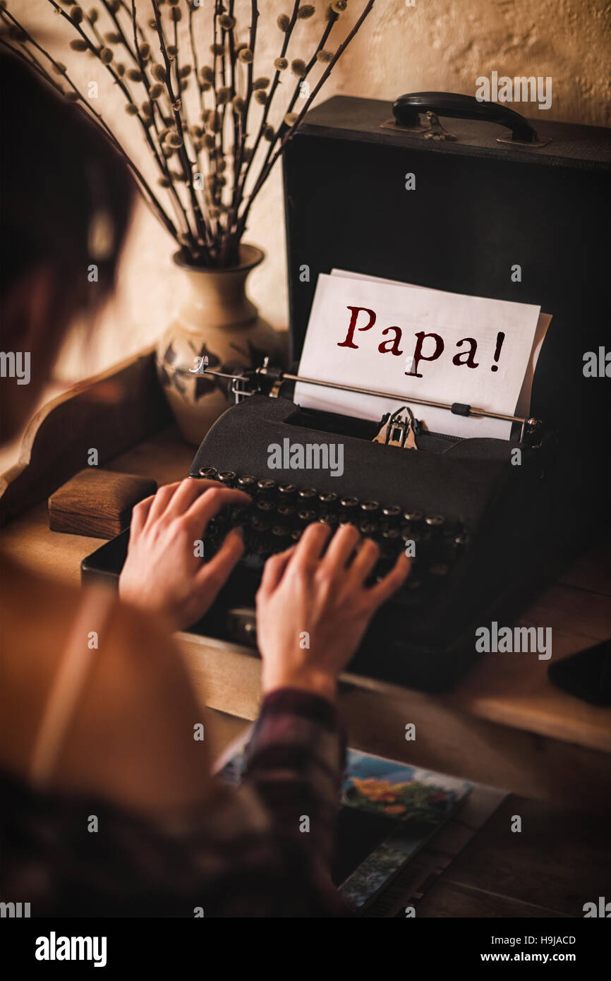 Woman typing on typewriter Stock Photo - Alamy