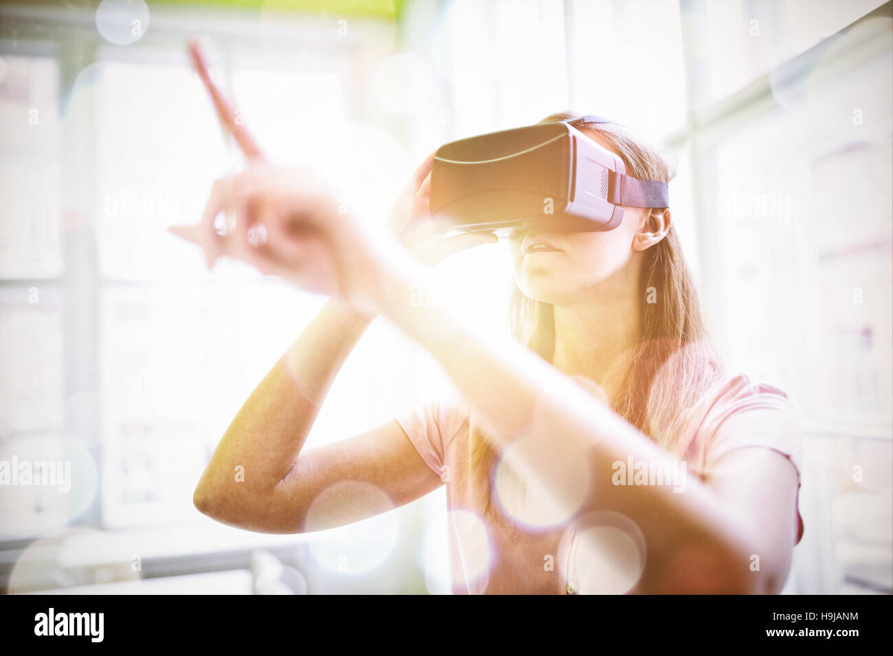 Woman using electronic device hi-res stock photography and images - Alamy