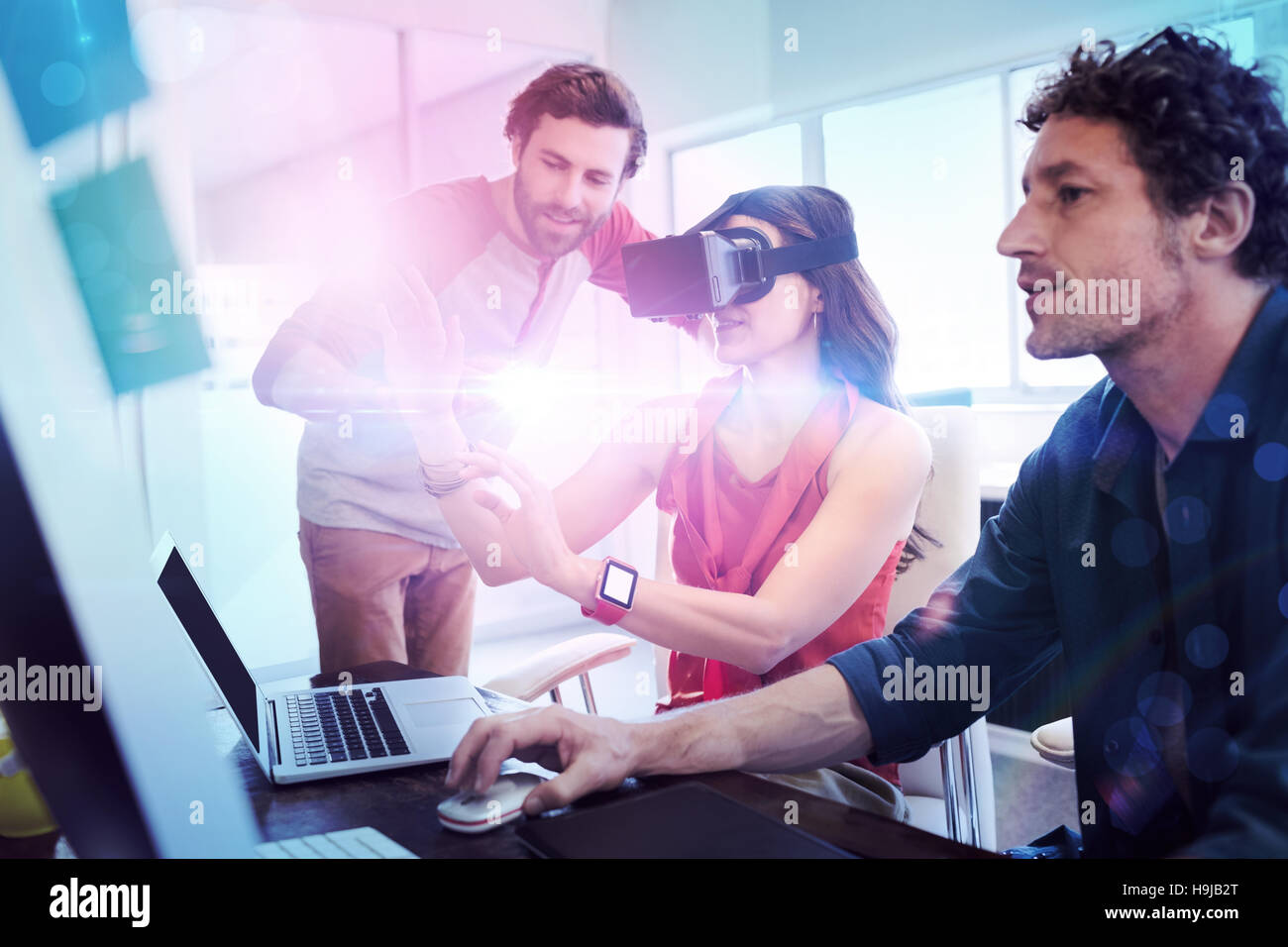 Colleagues using technology Stock Photo - Alamy