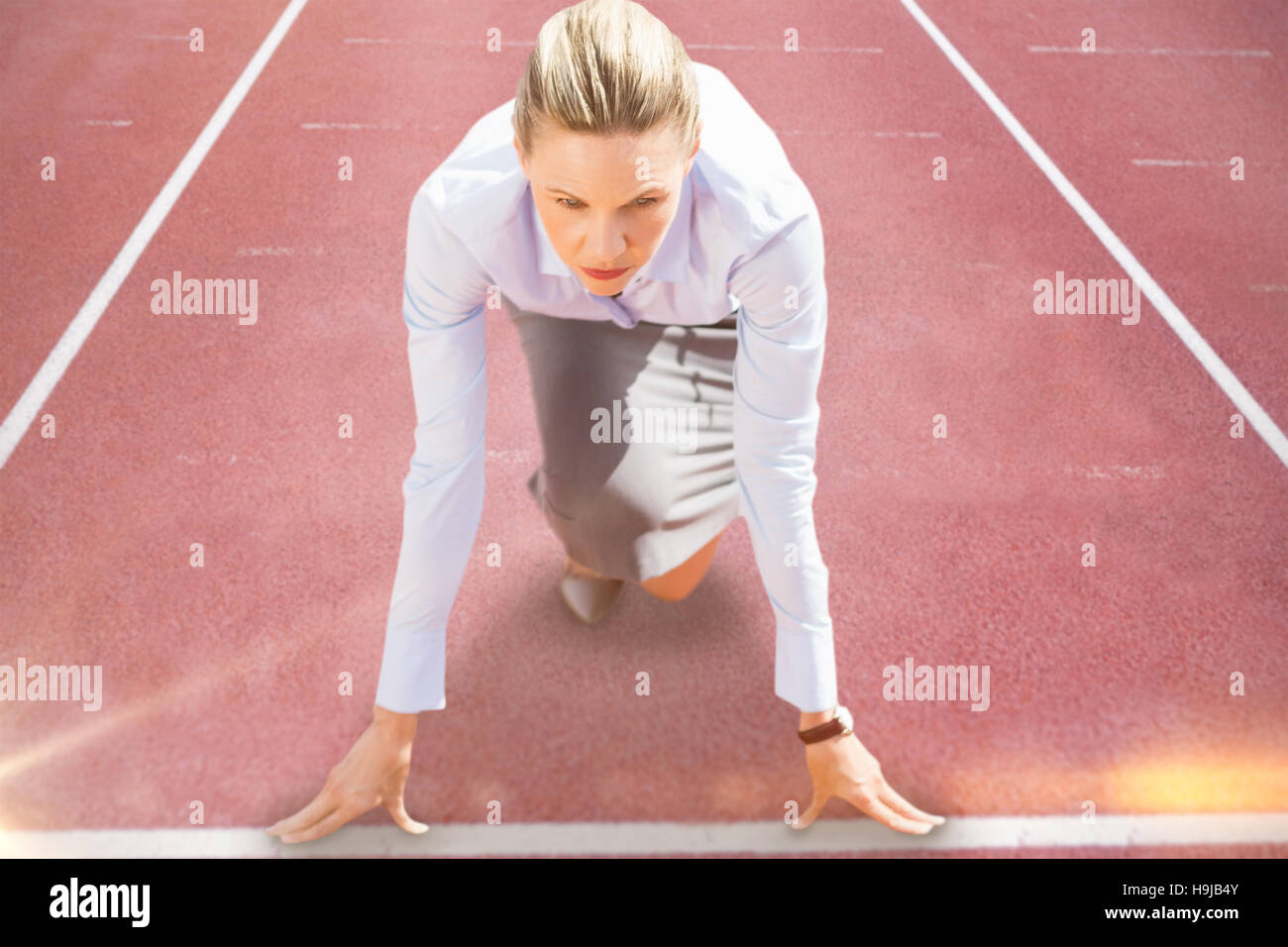 Starting blocks in suit hi-res stock photography and images - Alamy
