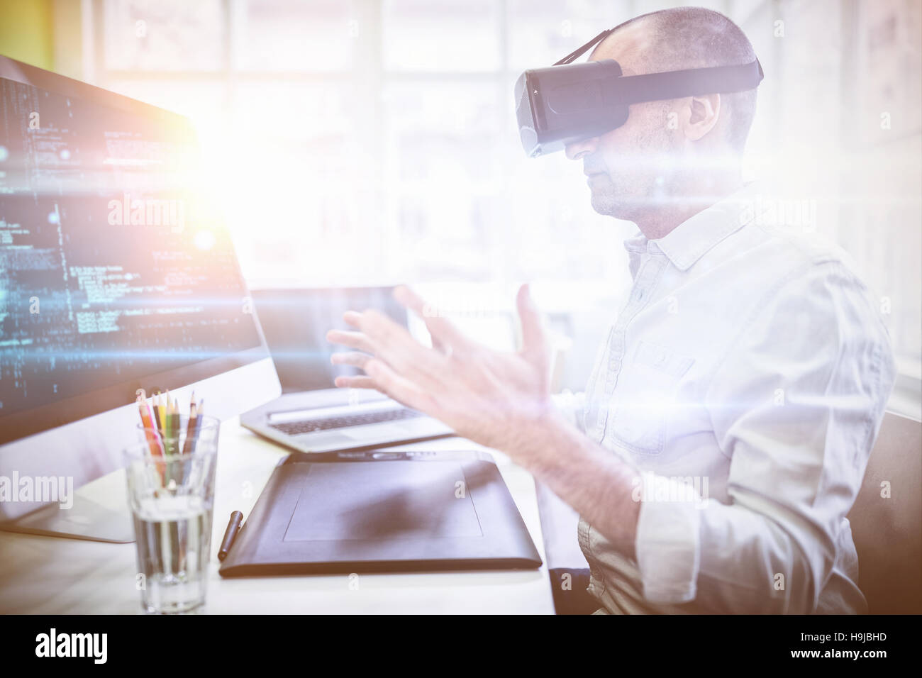 Businessman using laptop wearing headset hi-res stock photography and ...