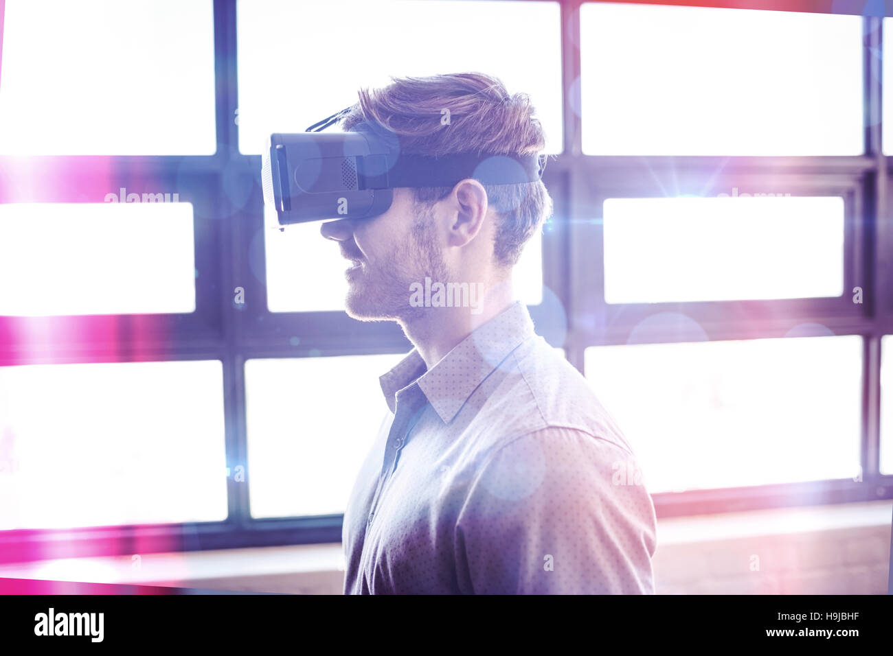 Businessman using virtual reality device Stock Photo - Alamy
