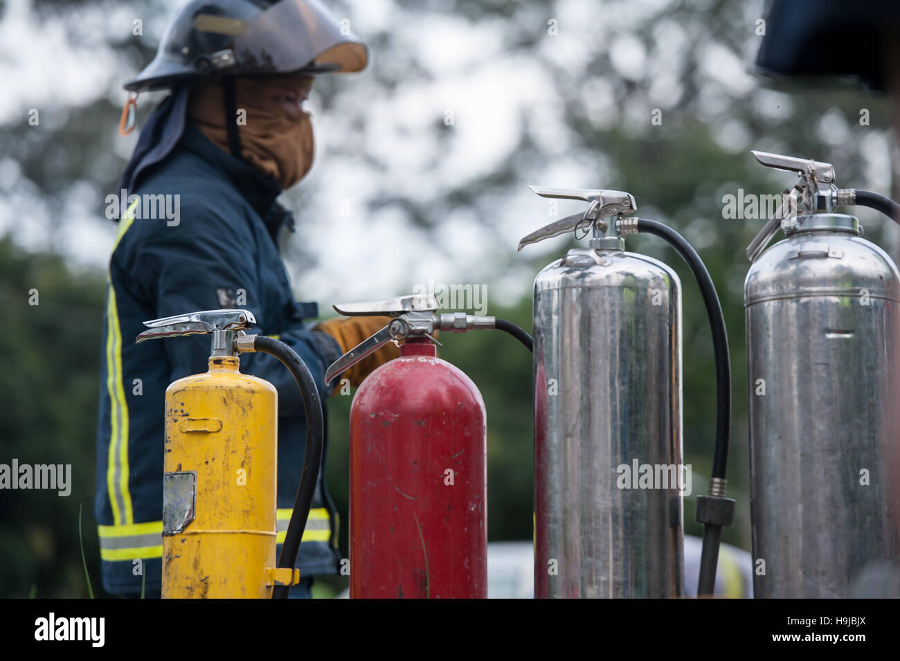 A firefighters dress their suit before the operating Stock Photo - Alamy