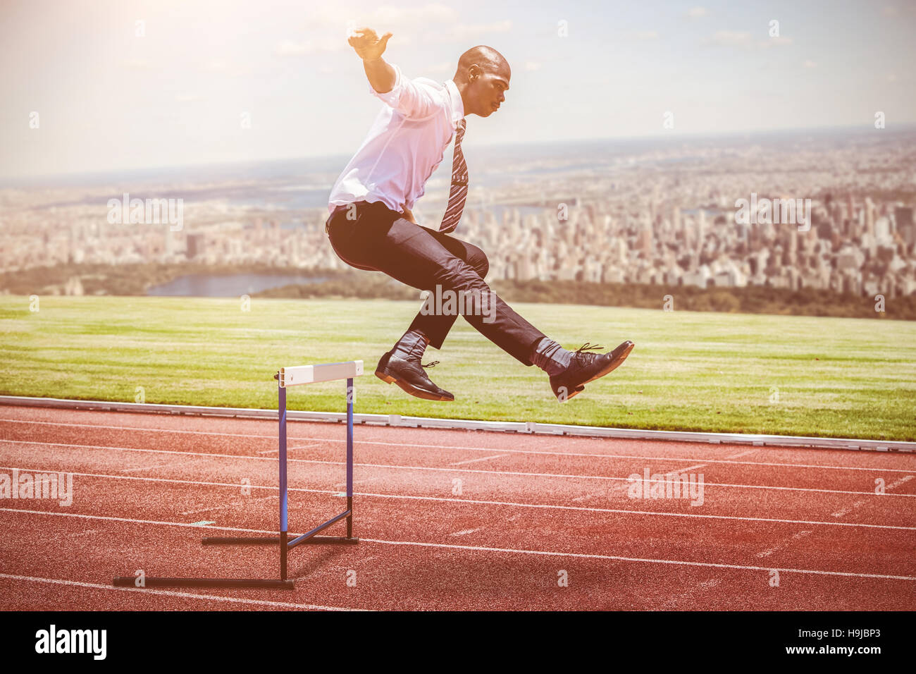 Man jumping hurdle hi-res stock photography and images - Alamy