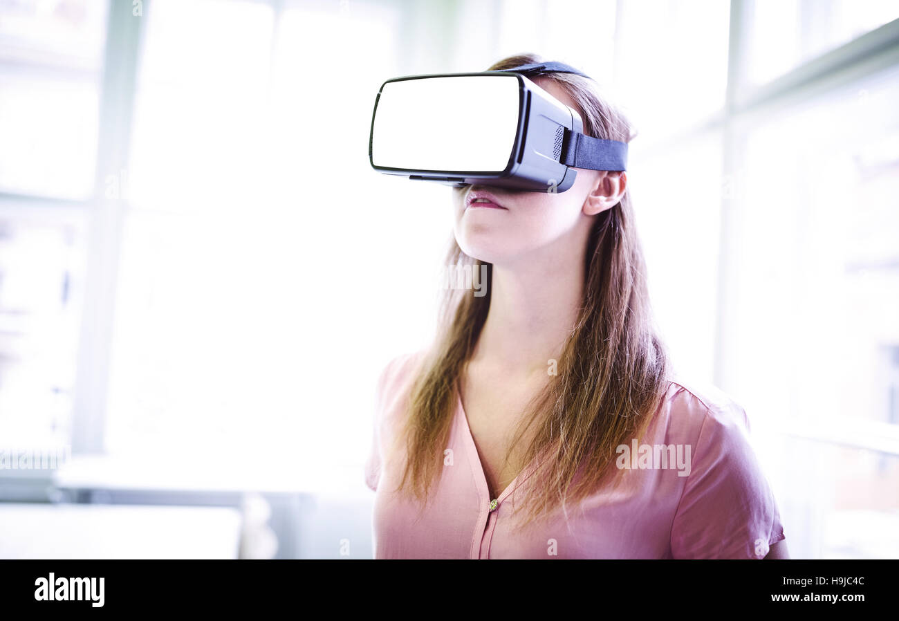 Graphic designer using virtual reality headset in office Stock Photo ...