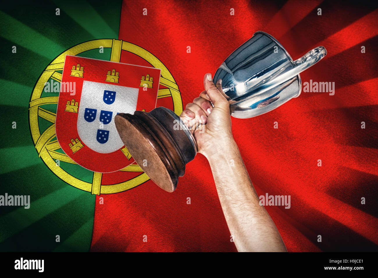Composite image of happy rugby player holding trophy Stock Photo - Alamy