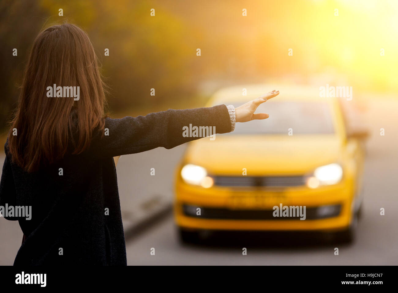Business woman hand gesture stopping classic yellow taxi Stock Photo ...