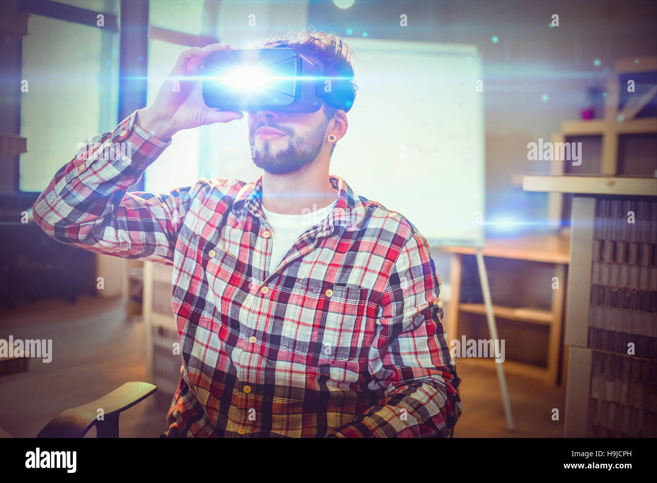Man using virtual reality headset Stock Photo - Alamy