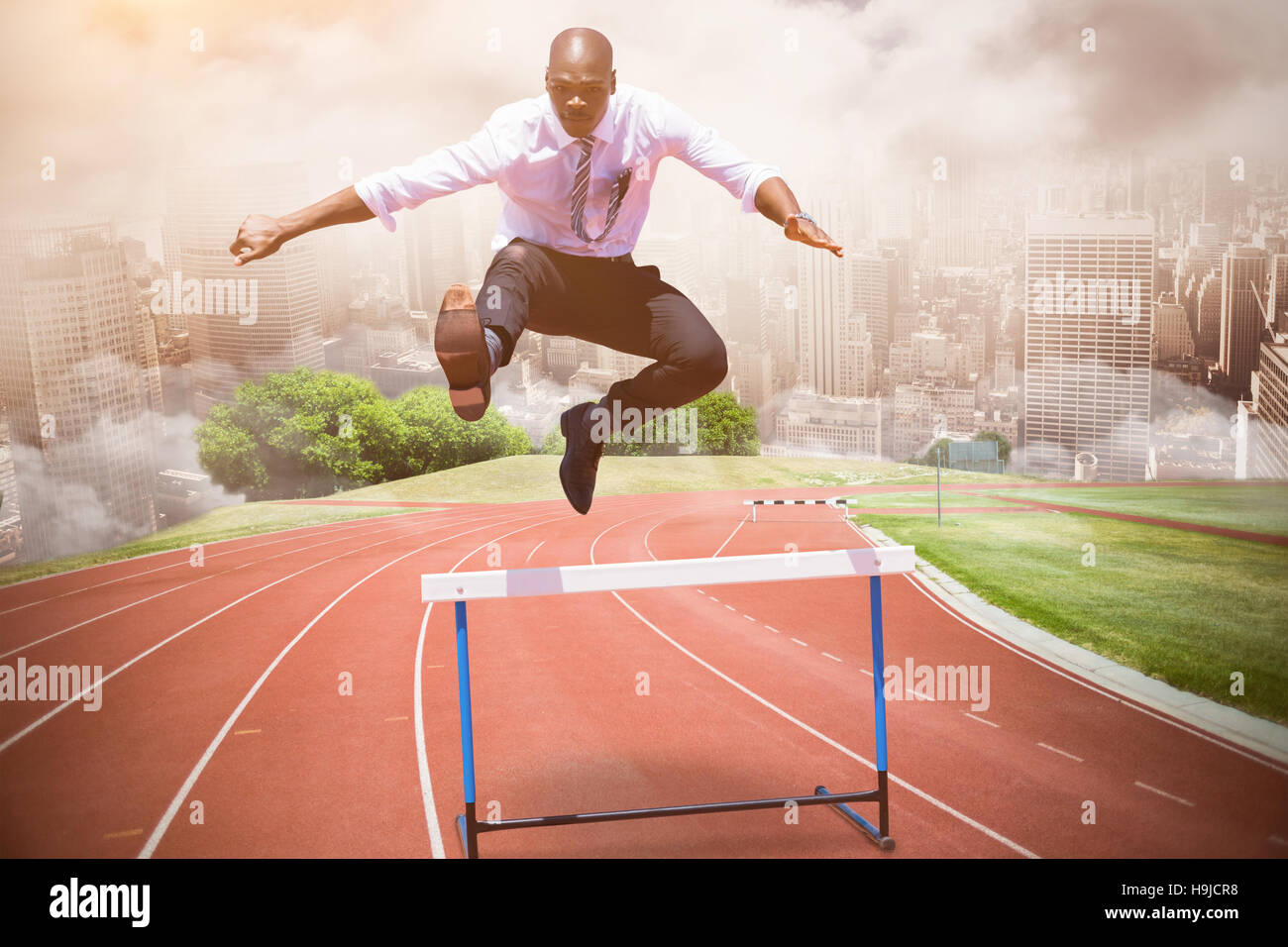 Man jumping hurdle hi-res stock photography and images - Alamy