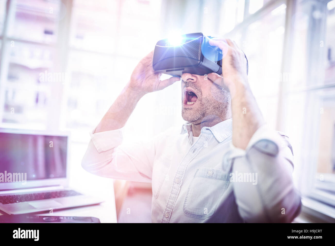 Man using a virtual reality device Stock Photo - Alamy