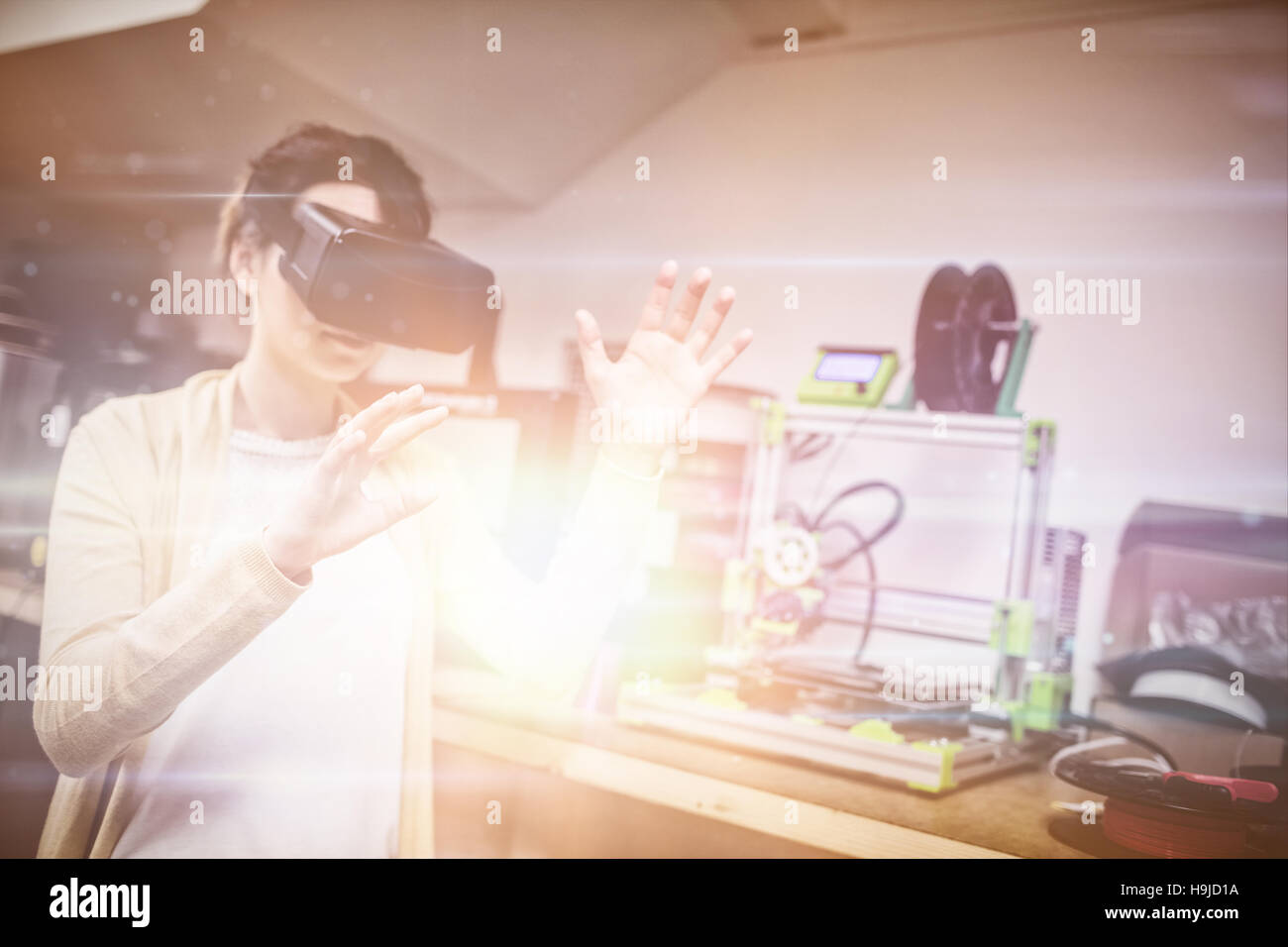 Female graphic designer using the virtual reality headset Stock Photo ...