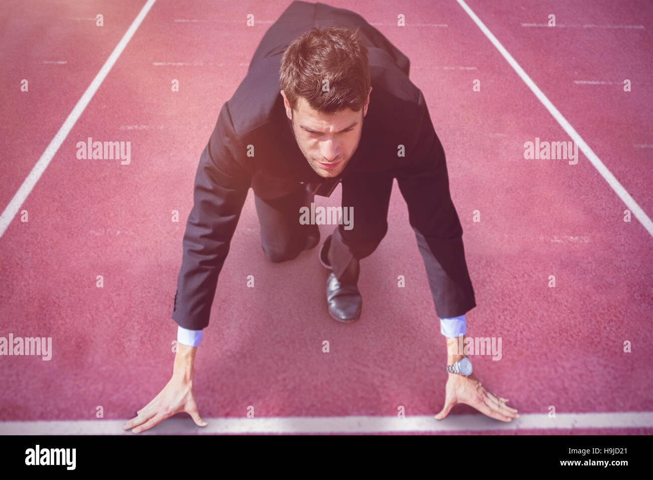 Starting blocks in suit hi-res stock photography and images - Alamy