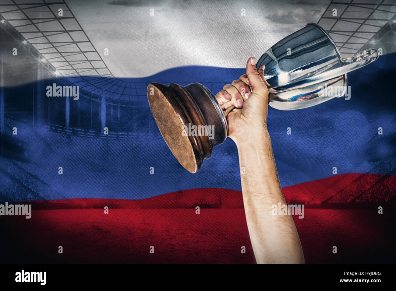 Composite image of happy rugby player holding trophy Stock Photo - Alamy