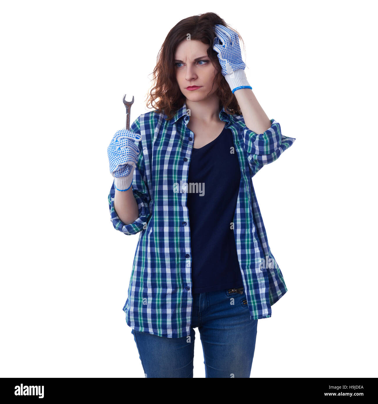 Young woman in casual clothes over white isolated background wrench ...